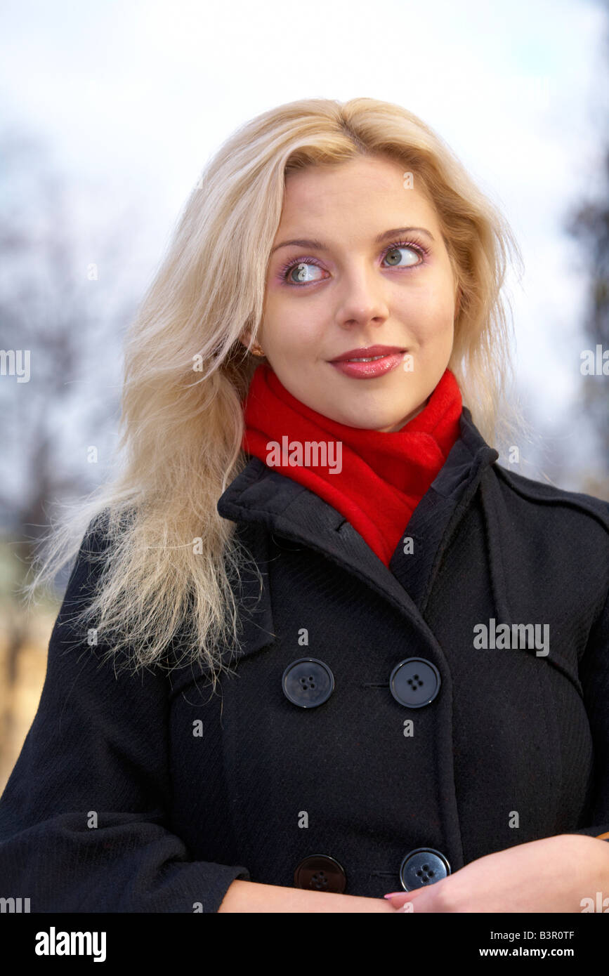 Young woman contemplating in park Stock Photo - Alamy