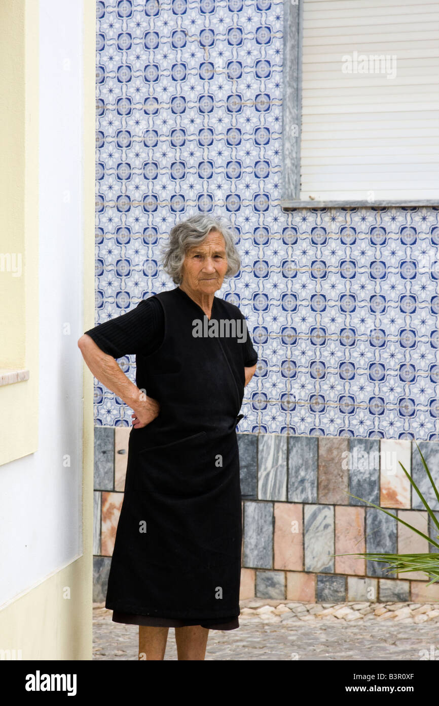 Portuguese Older Woman Standing outside of Home Stock Photo - Alamy