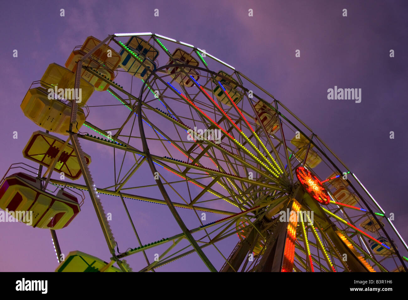 Riders on a ferris wheel Stock Photo - Alamy
