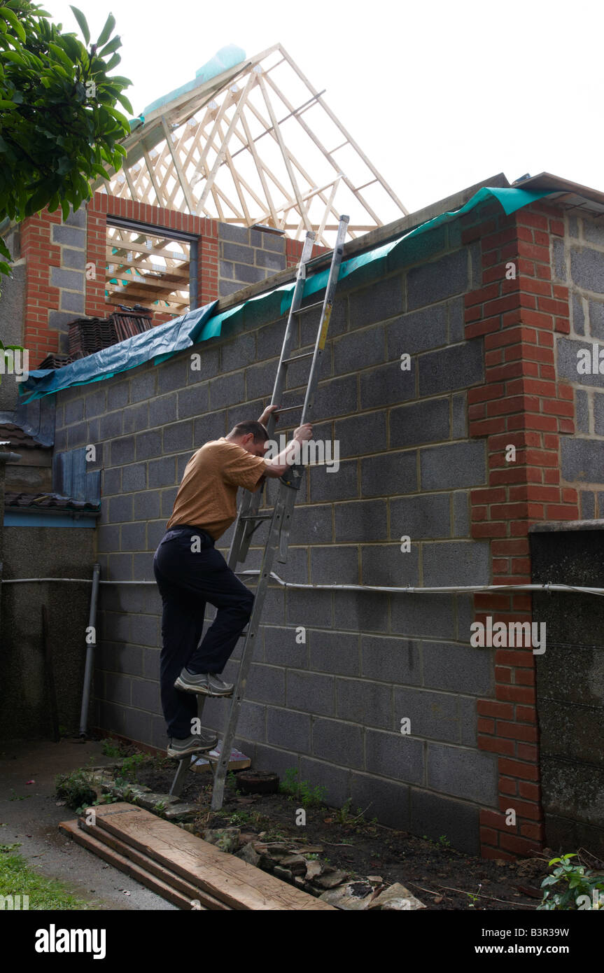 Ladder leaning against brick wall hi-res stock photography and images ...