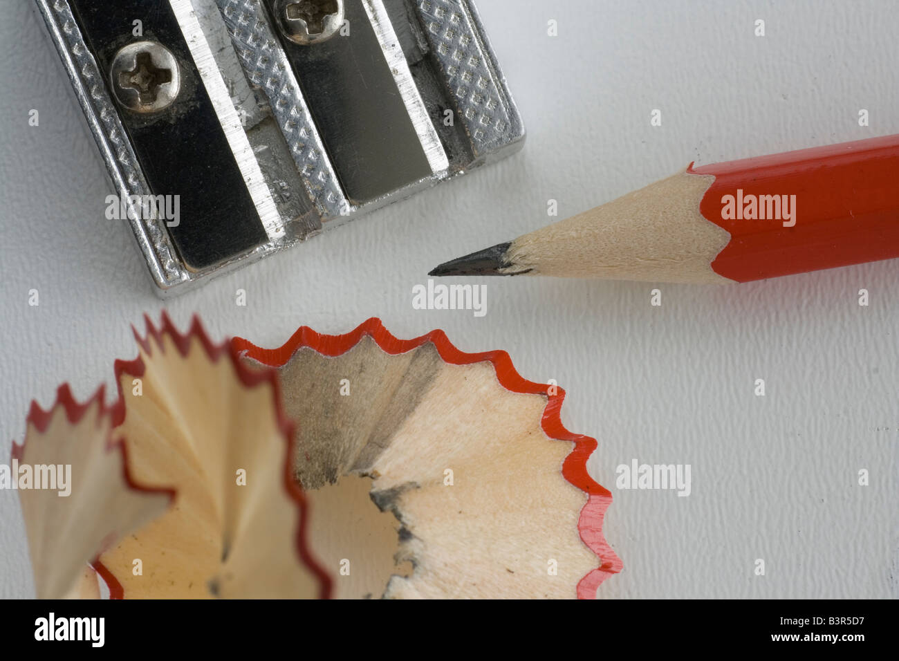 Pencil sharpener and shavings Stock Photo - Alamy