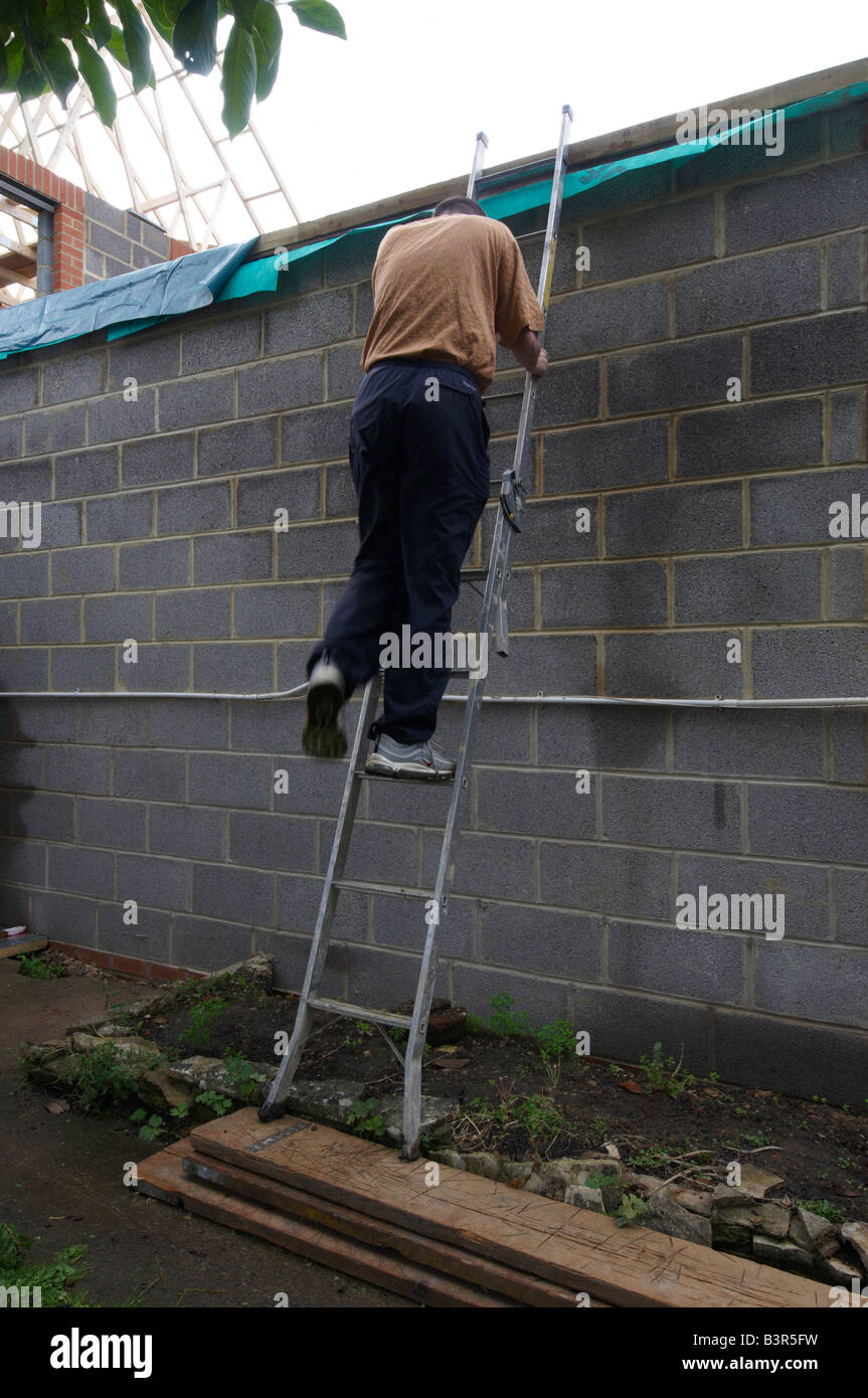 Ladder leaning against brick wall hi-res stock photography and images ...