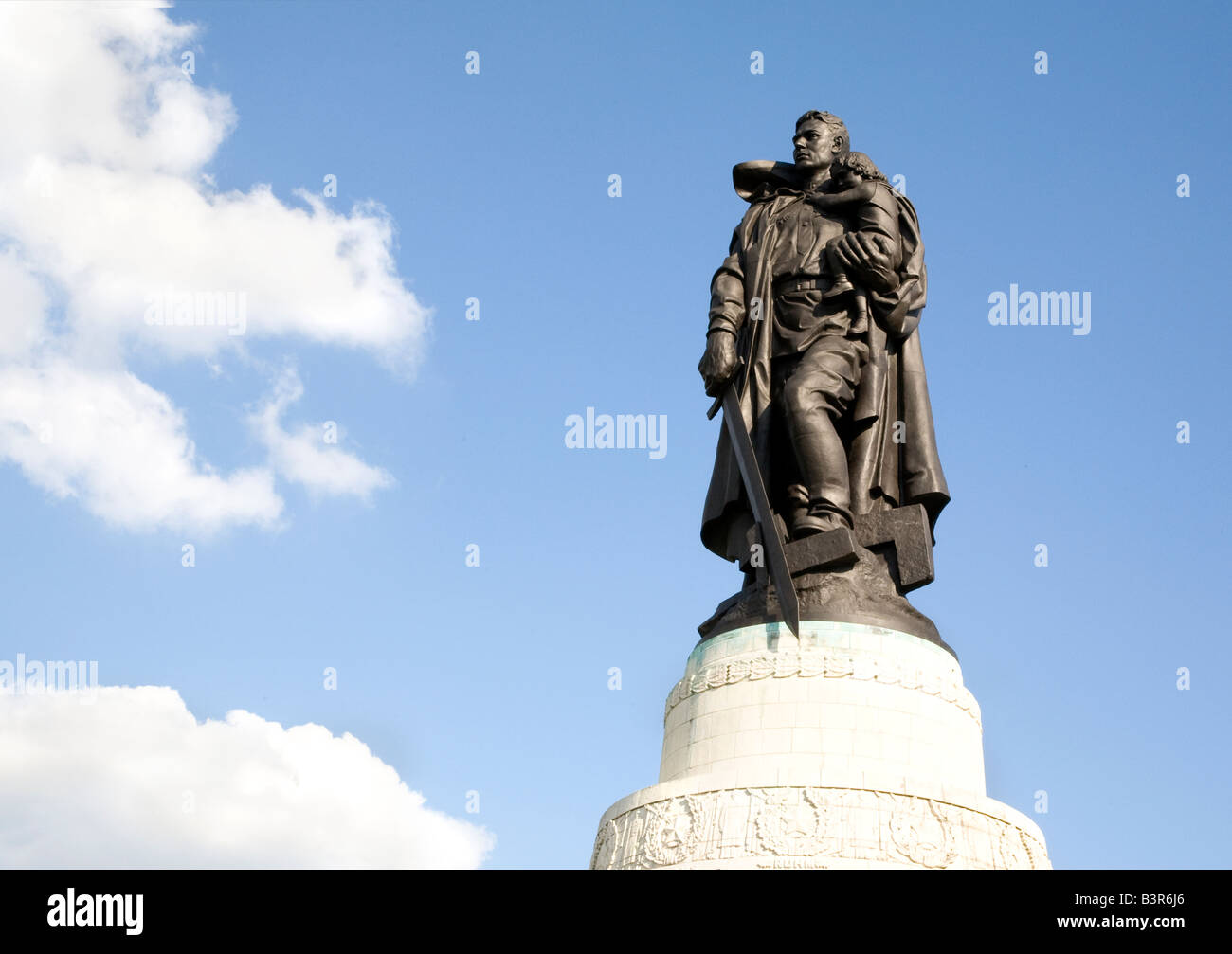 The statue of the Soviet soldier holding a child Stock Photo - Alamy