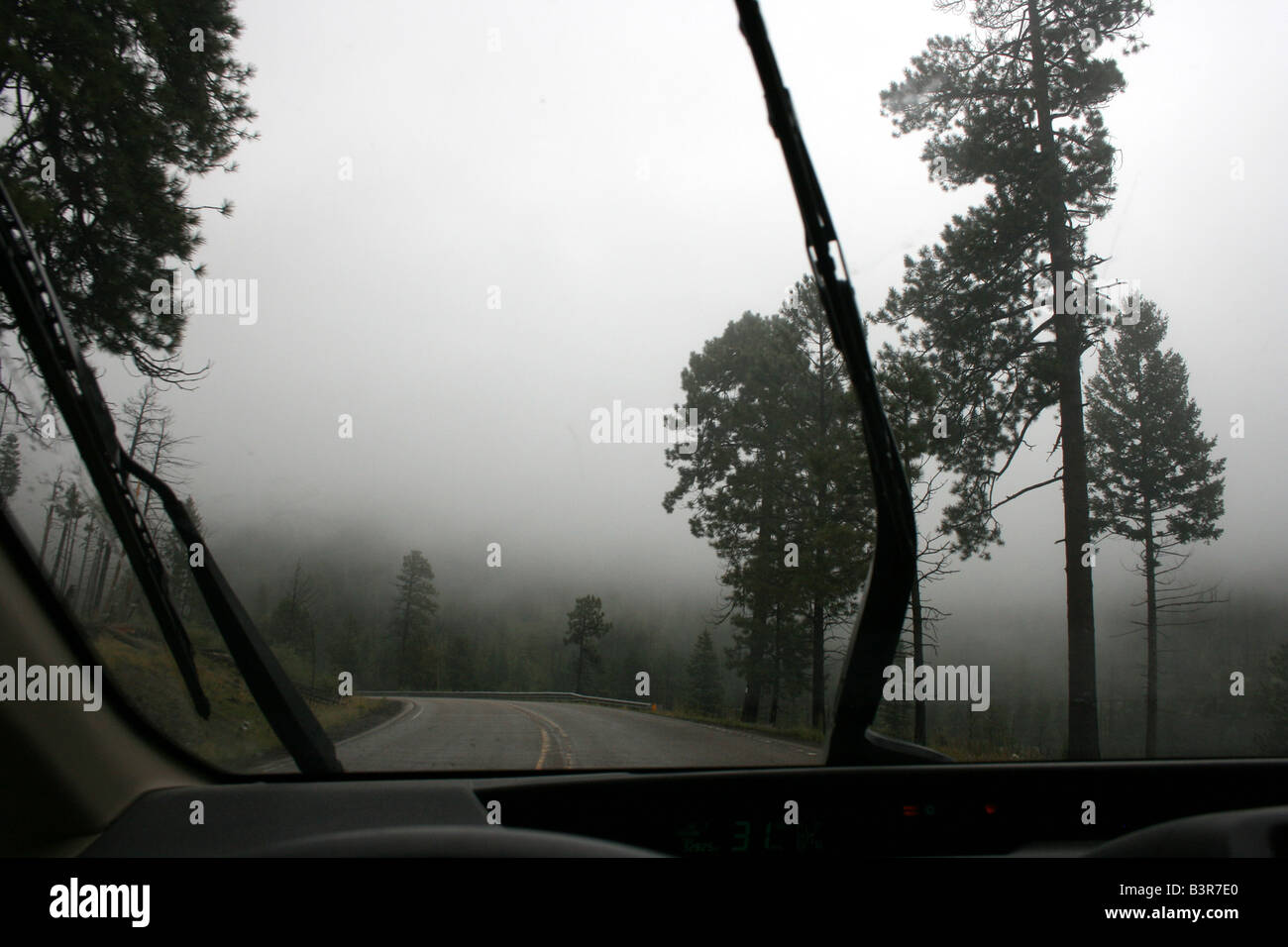 view through windshield driving through storm, Jemez mountains, New ...