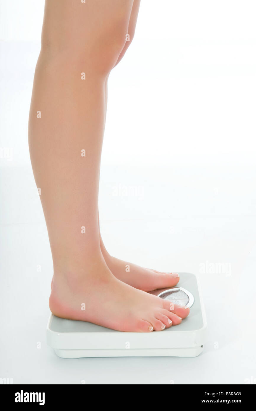 beautiful woman legs with scales on white Stock Photo - Alamy