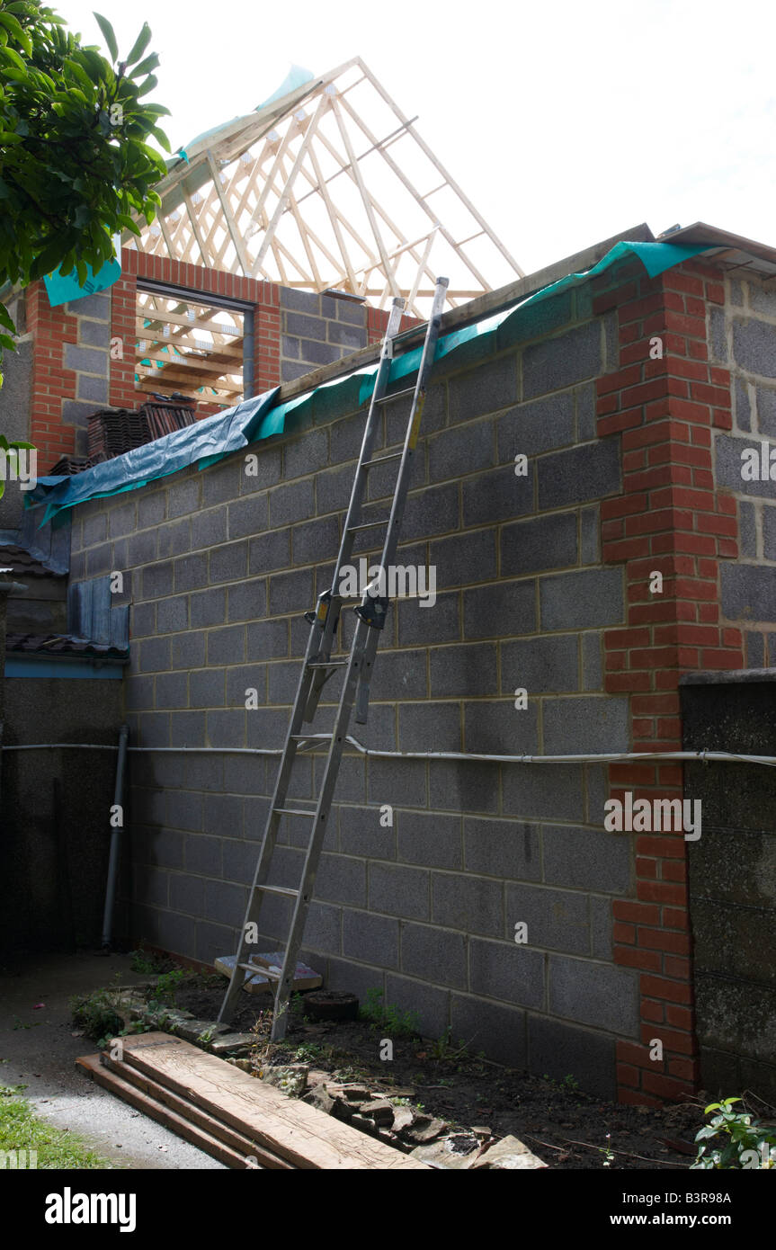 Ladder leaning against building hi-res stock photography and images - Alamy