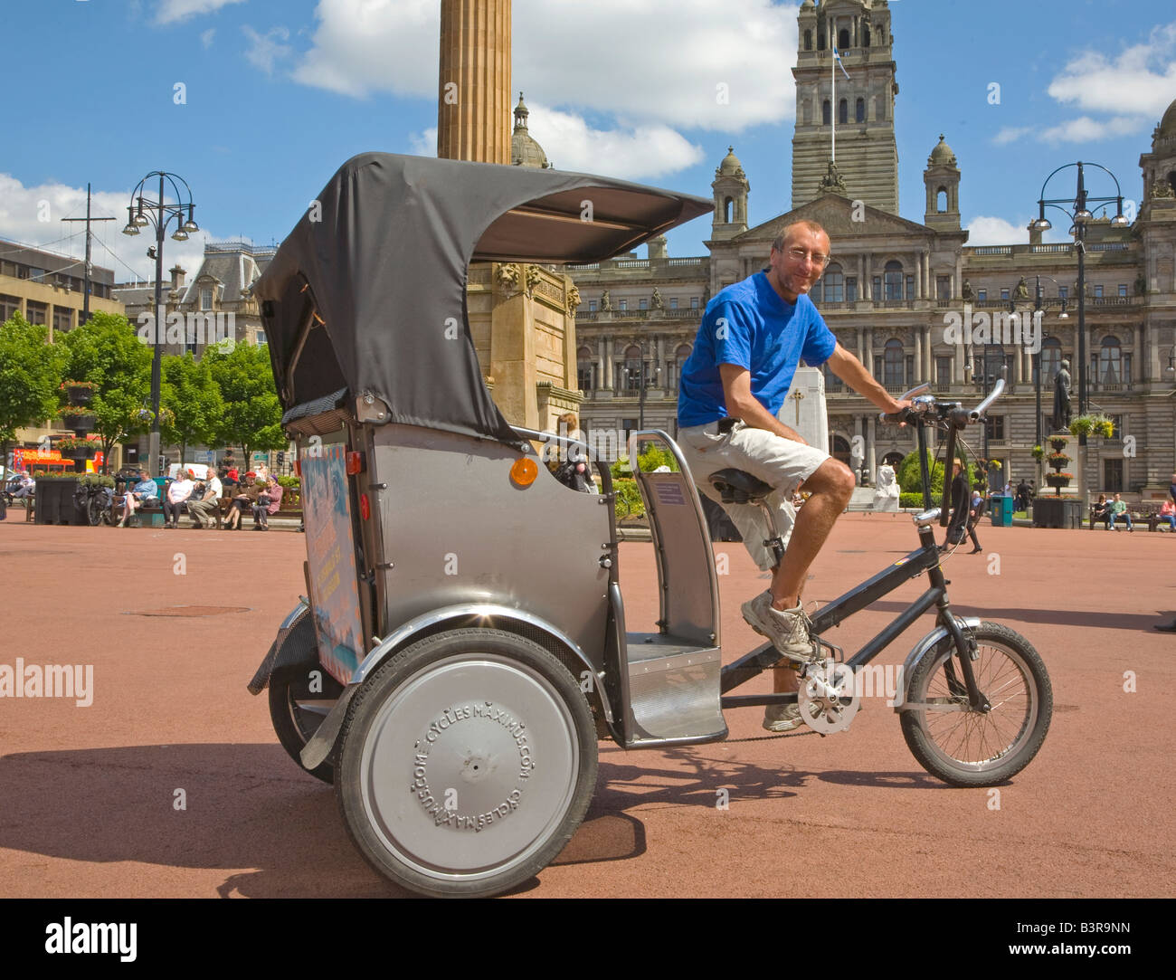 Tommy Brown, riding his Tourist Rickshaw bicycle in George Square ...