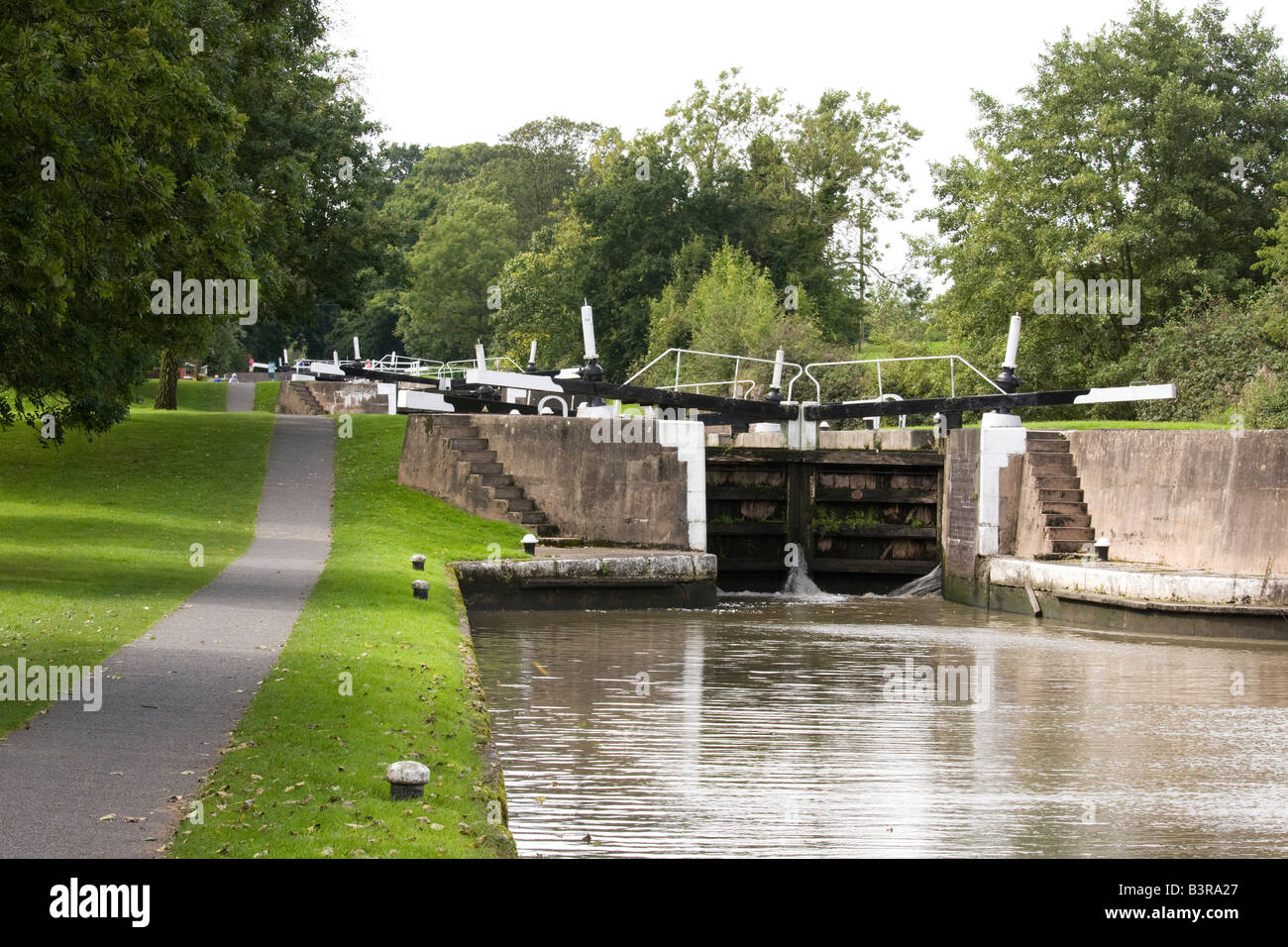 path along side flight of locks at Hatton Warwickshire England Stock ...
