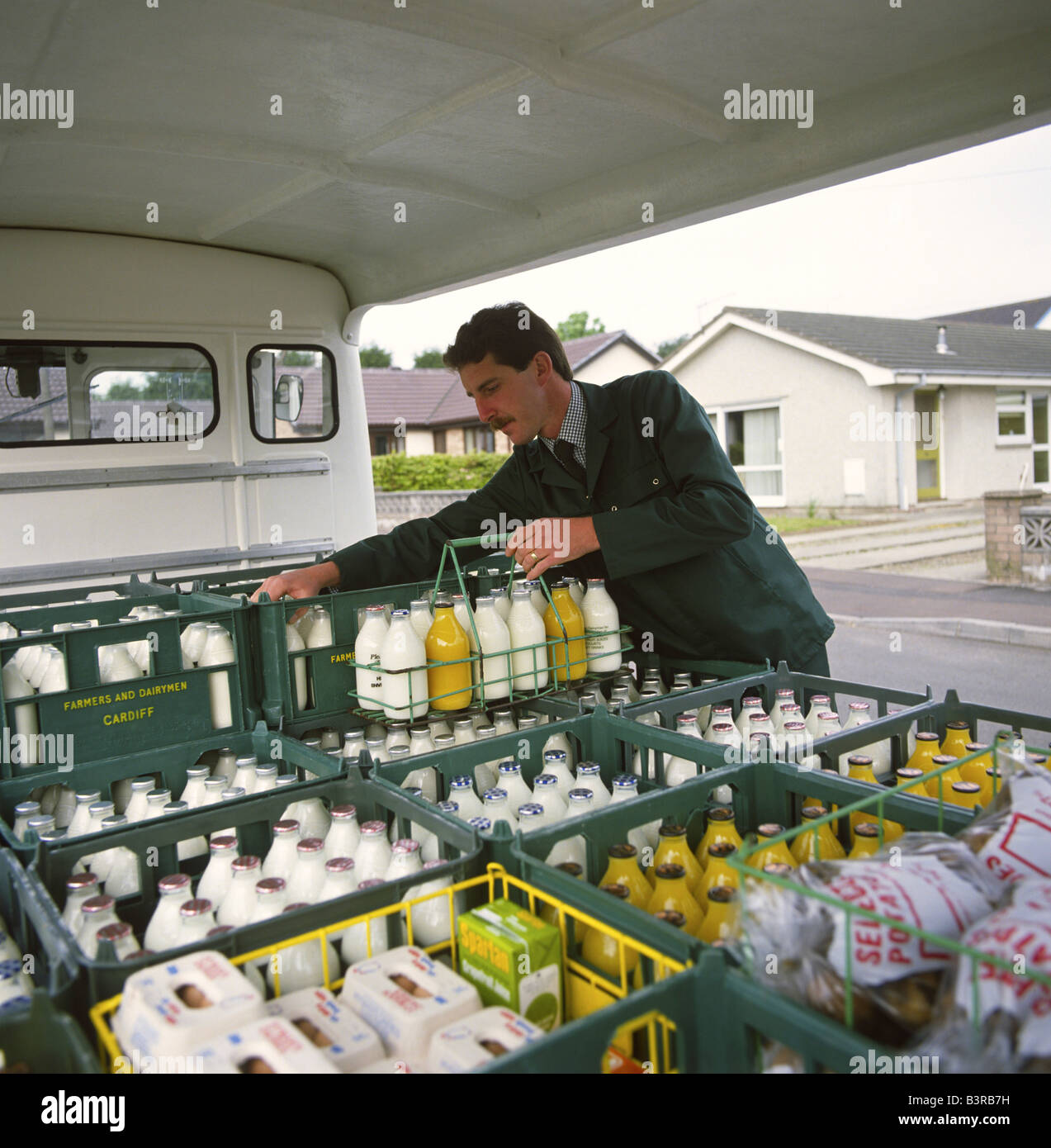 Milkman on his round Stock Photo - Alamy