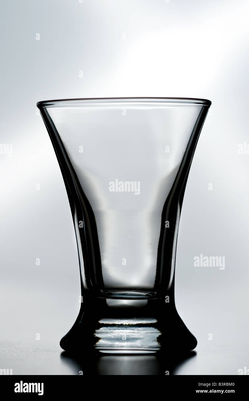 single empty shot glass Stock Photo - Alamy