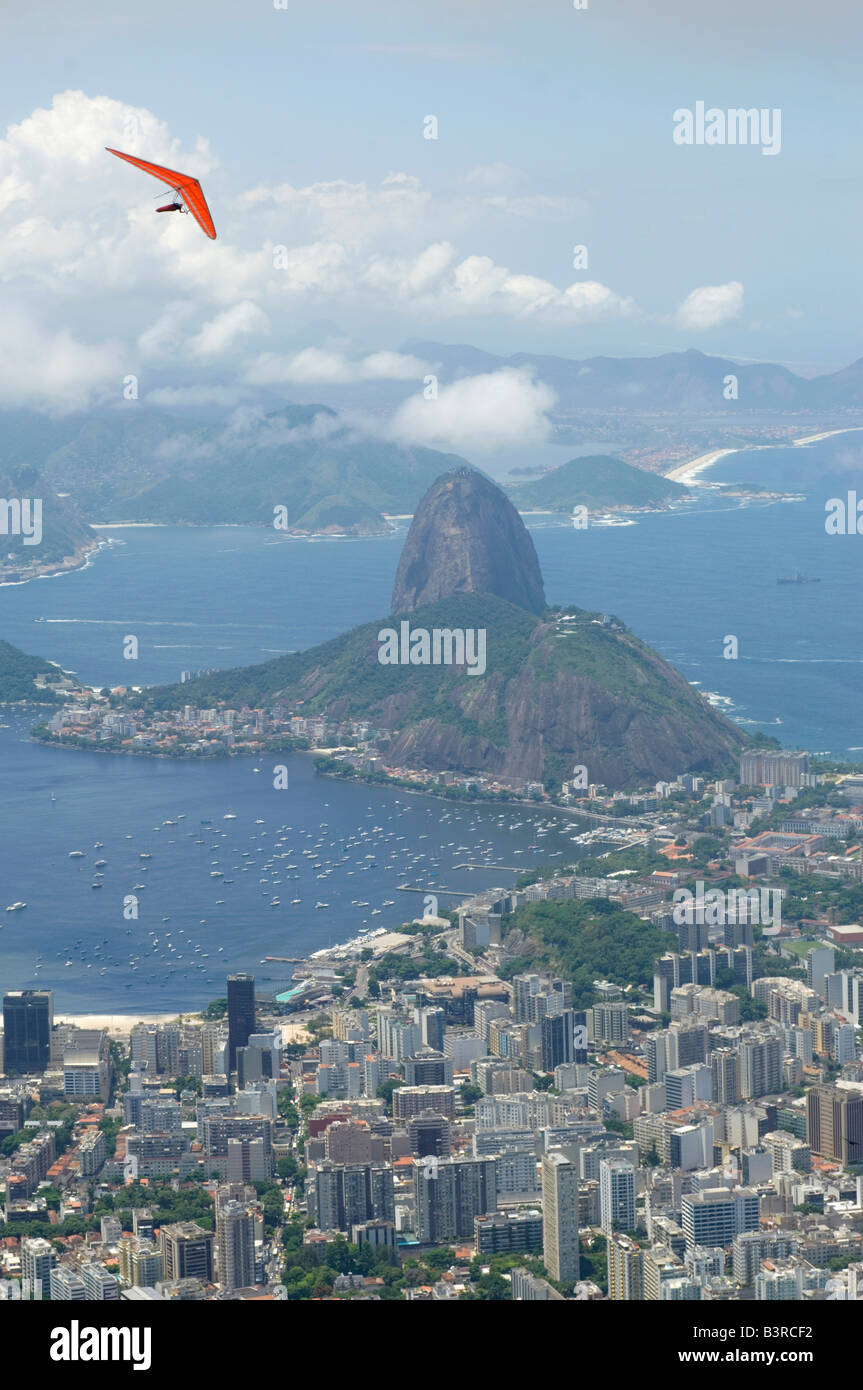 An aerial view of a hang glider over Rio De Janeiro with Sugarloaf ...