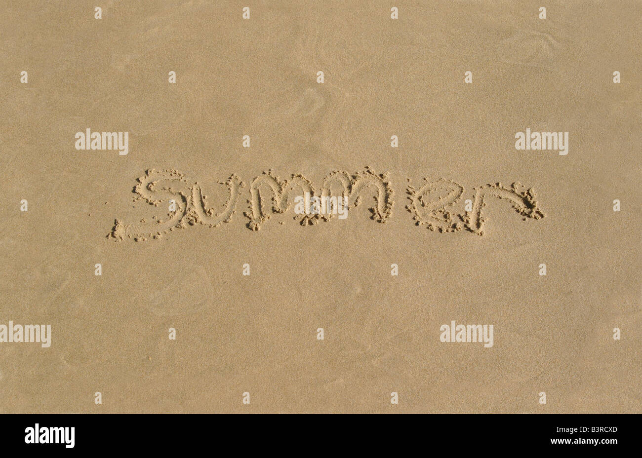 The word SUMMER written in the sand on the beach Stock Photo - Alamy