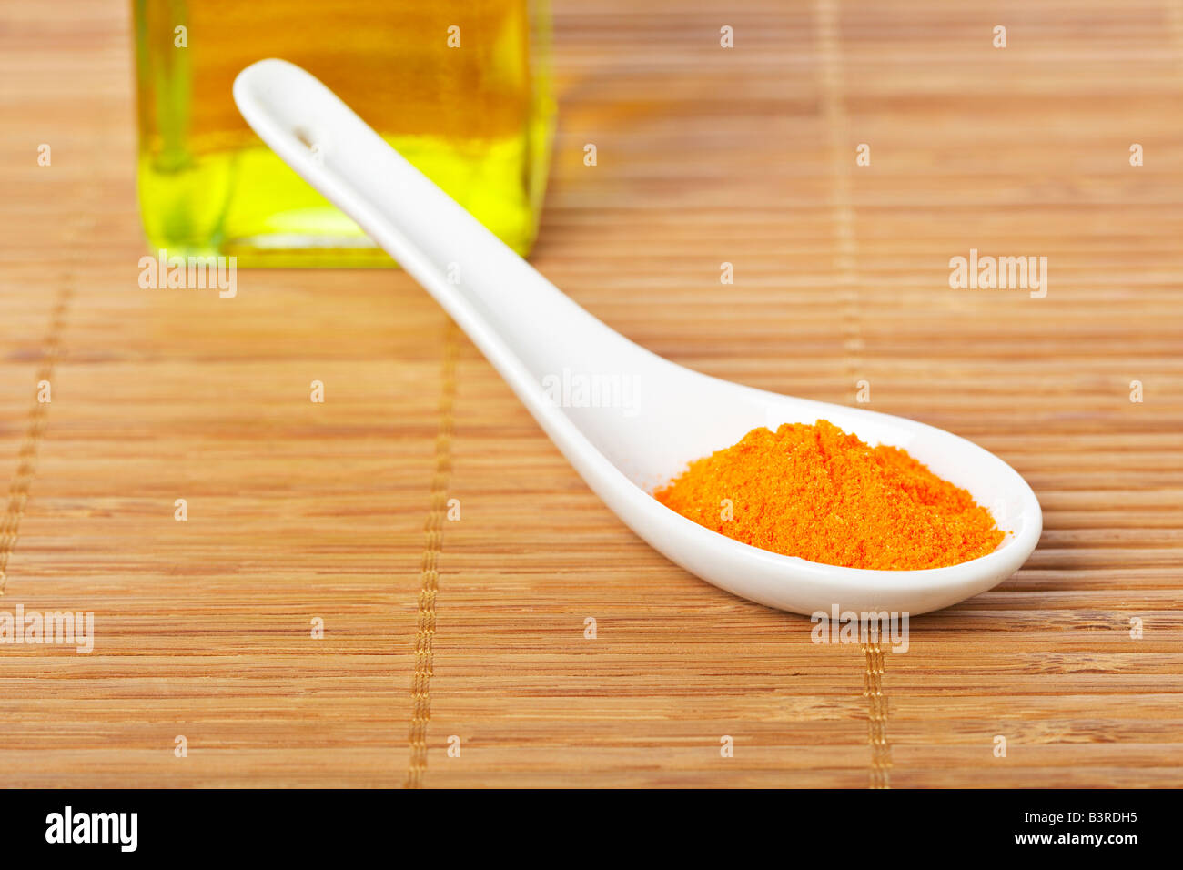 Saffron in the spoon and oil bottle for prepare tasty food with soft ...