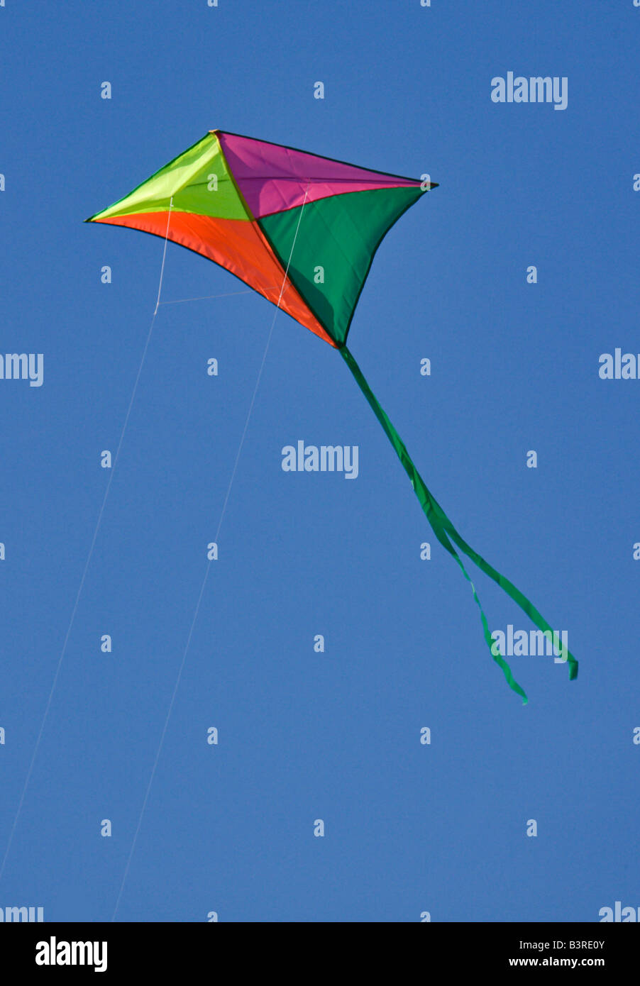 Colourful Kite flying in a pure blue sky, UK Stock Photo - Alamy