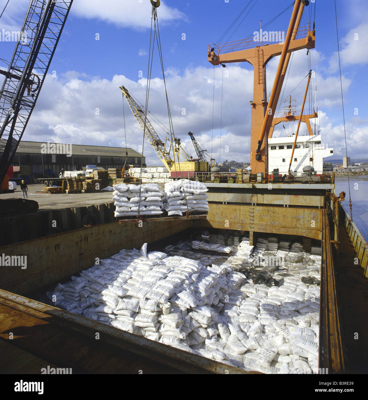 Unloading Bags of Fertilizer from Ships Hold Stock Photo - Alamy
