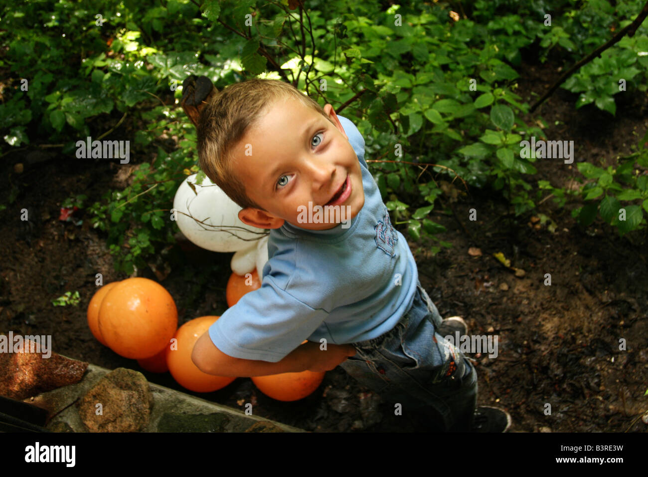 Kid with balloons Stock Photo - Alamy
