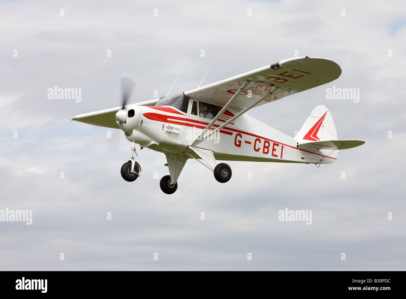 Piper PA-22-108 Colt G-CBEI in flight at Breighton Airfield Stock Photo ...
