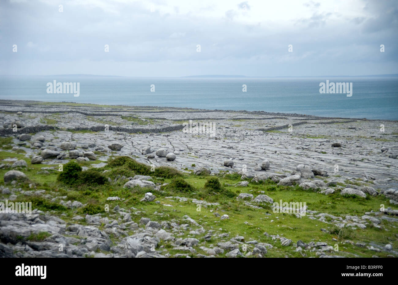 The Irish coastline across the Burren with the three Aran Islands on ...