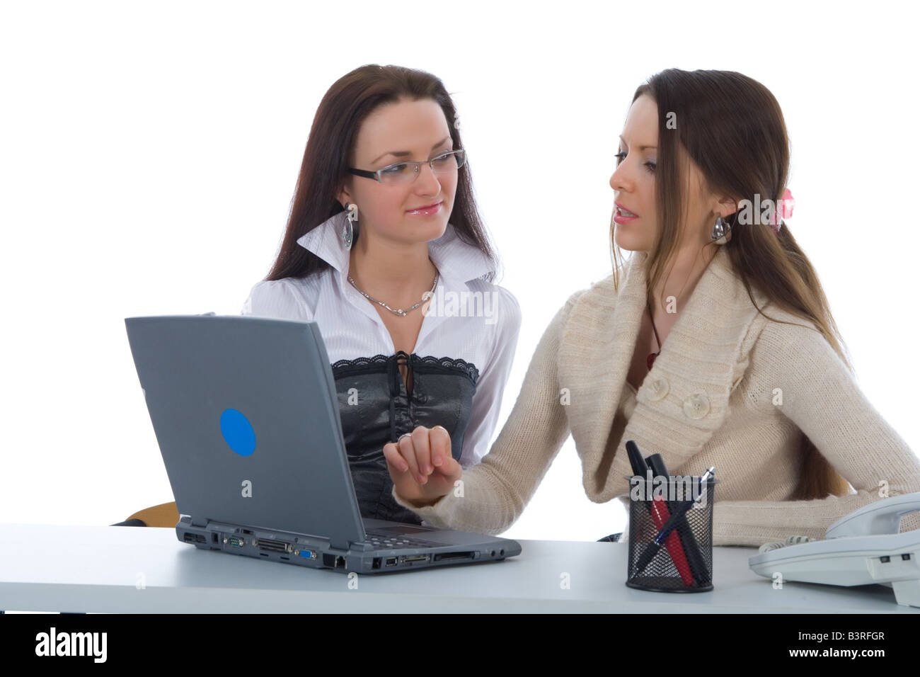 Two business woman work with laptop on white Stock Photo - Alamy