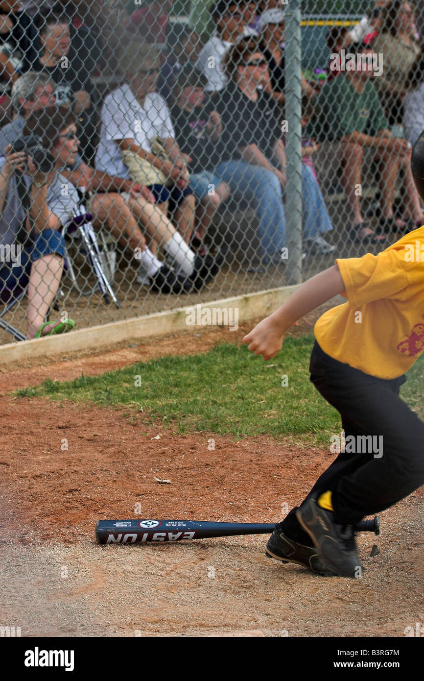 A youngster connects with the baseball in coach-pitch little league ...