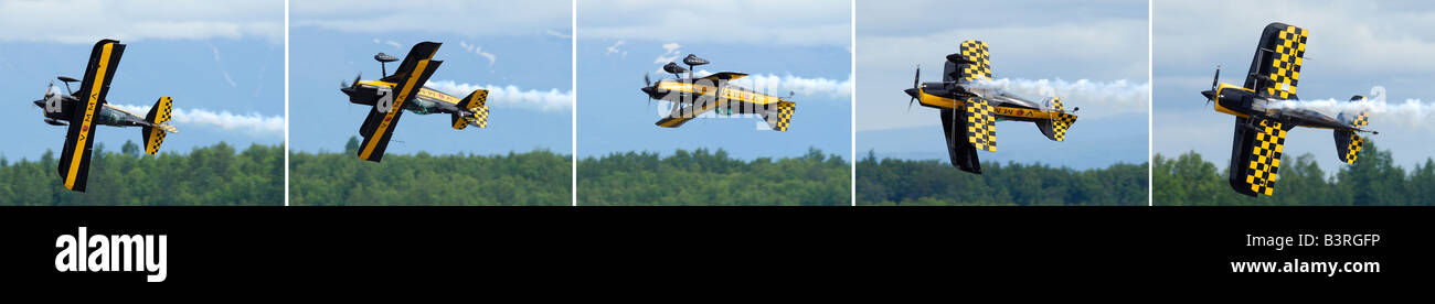 Aerobatic biplane Pitts S-1 11B of pilot Jon Melby doing a roll at low ...