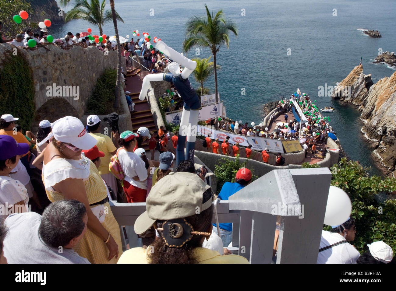 The audience watch divers walking down the steps at the Acapulco Xtreme ...