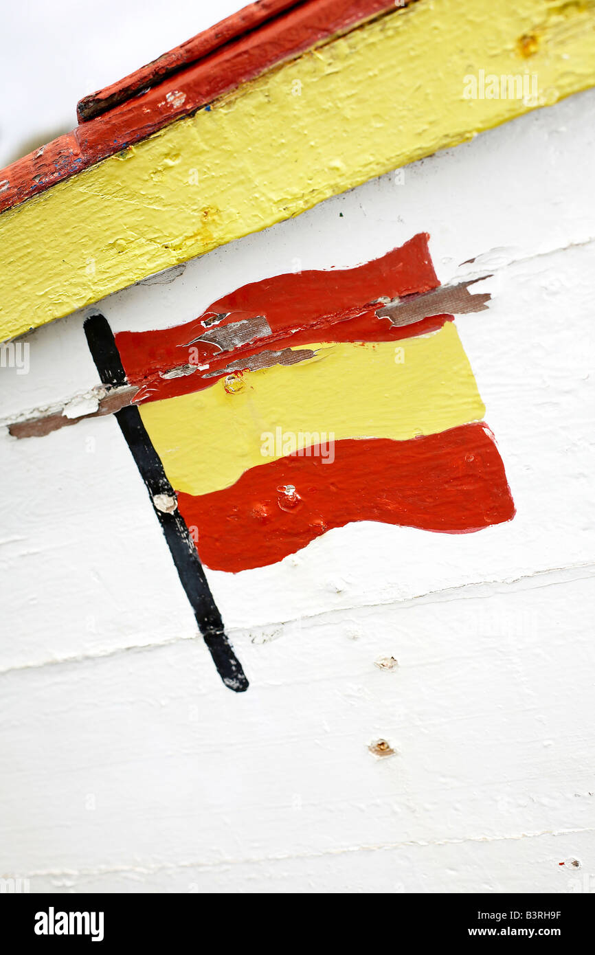 A fishing boat with the Spanish flag painted on the bow on the Costa ...