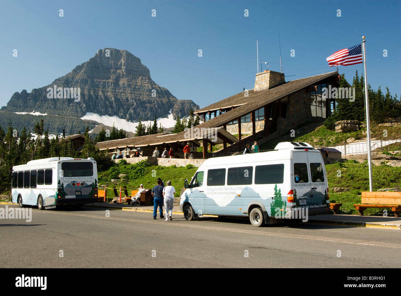 buses at the visitor center at Logan Pass in Glacier National Park ...