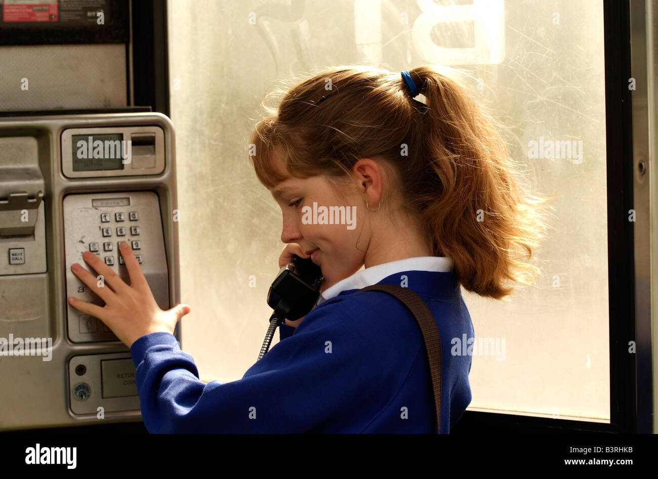 Child using callbox telephoning from a payphone which BT tend to remove ...