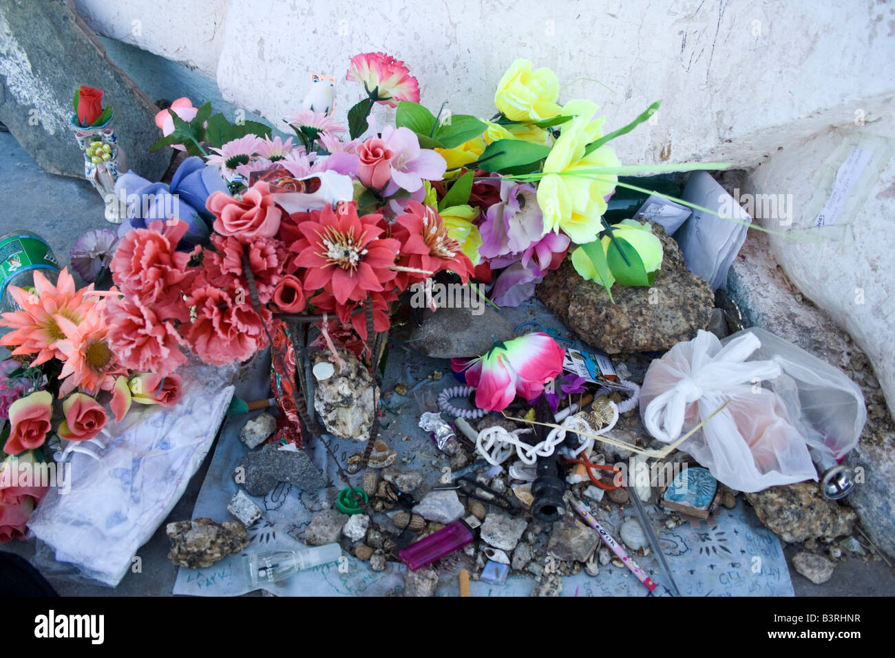 Offerings at the base of the statue of Nuestra Señora de Belen in Belen ...