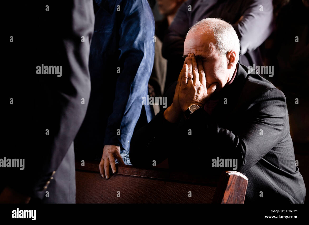 Man praying in church hi-res stock photography and images - Alamy