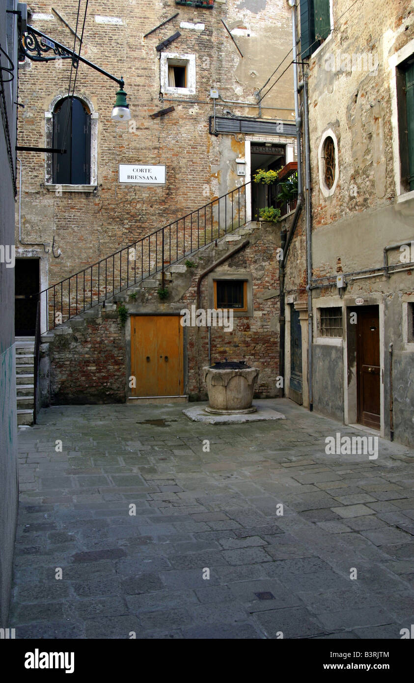 An obscure alleyway leads to hidden courtyard in Venice, Italy Stock ...