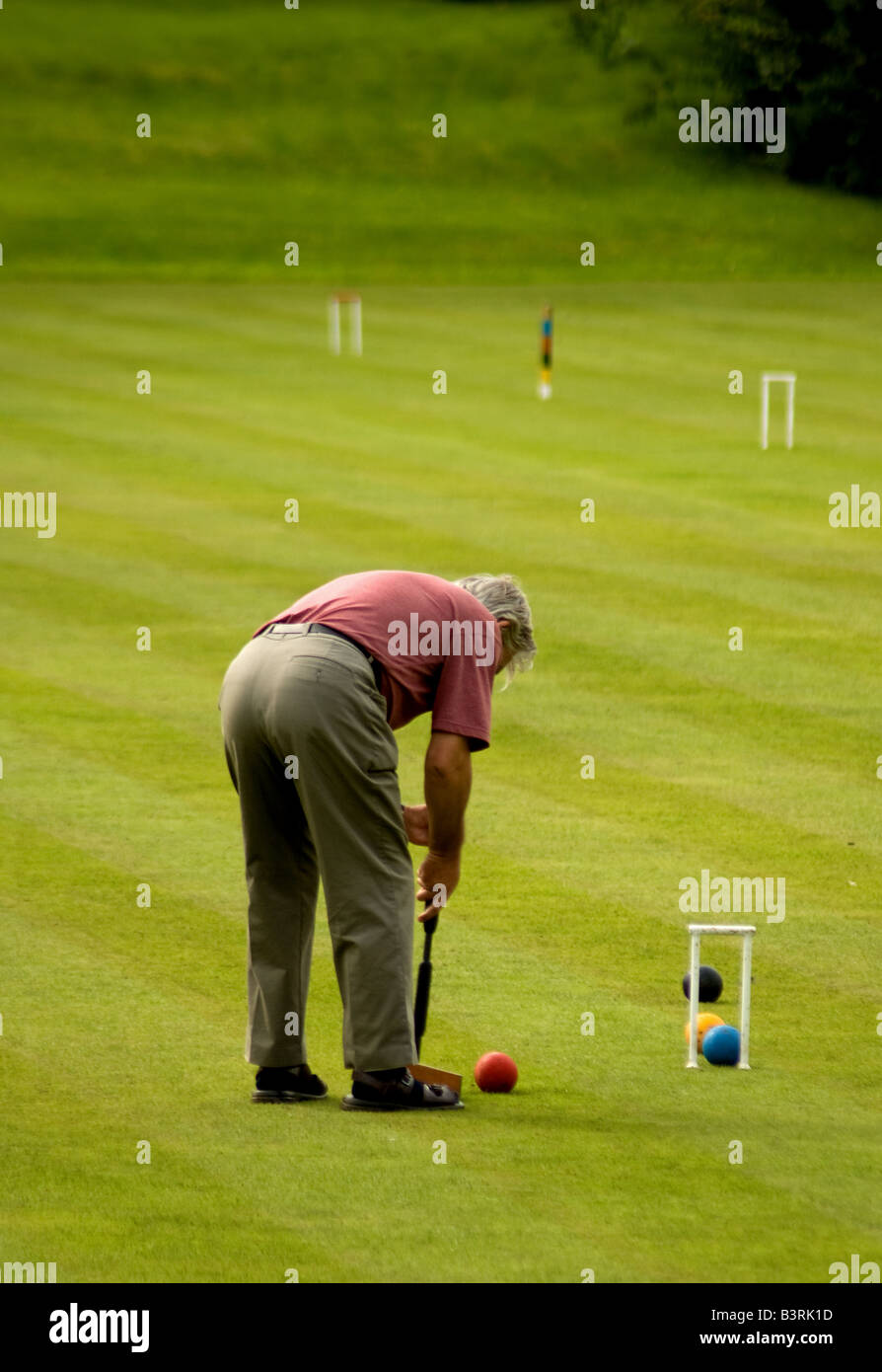 Man playing croquet Stock Photo - Alamy