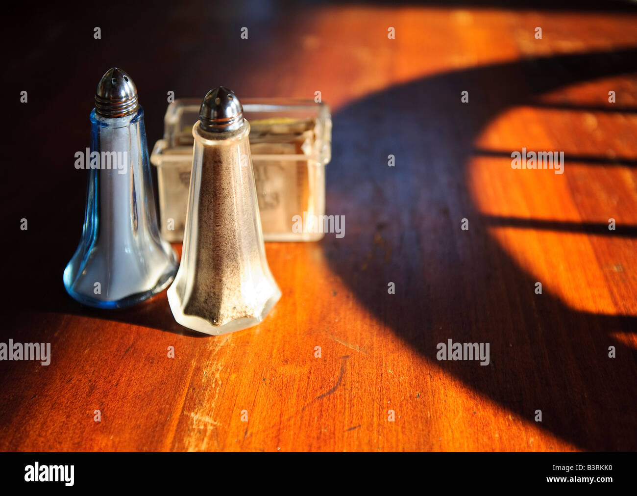 Cafe table bathed in morning light Stock Photo - Alamy