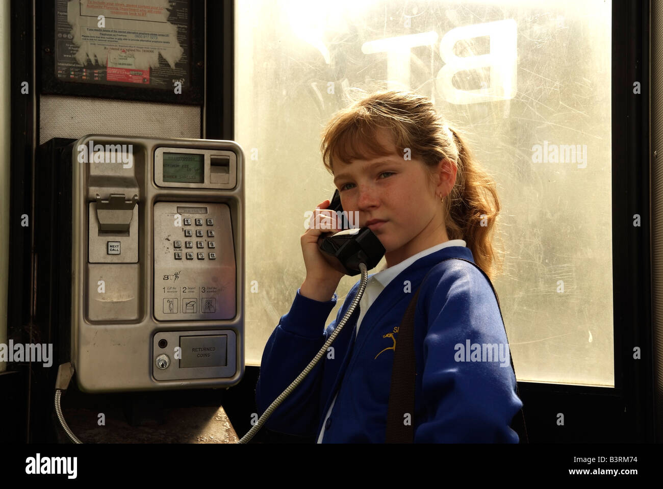 Child using callbox telephoning from a payphone which BT tend to remove ...