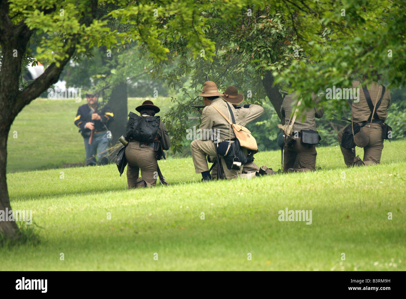 Confederate and Union soldiers face off during a battle at a Civil War ...