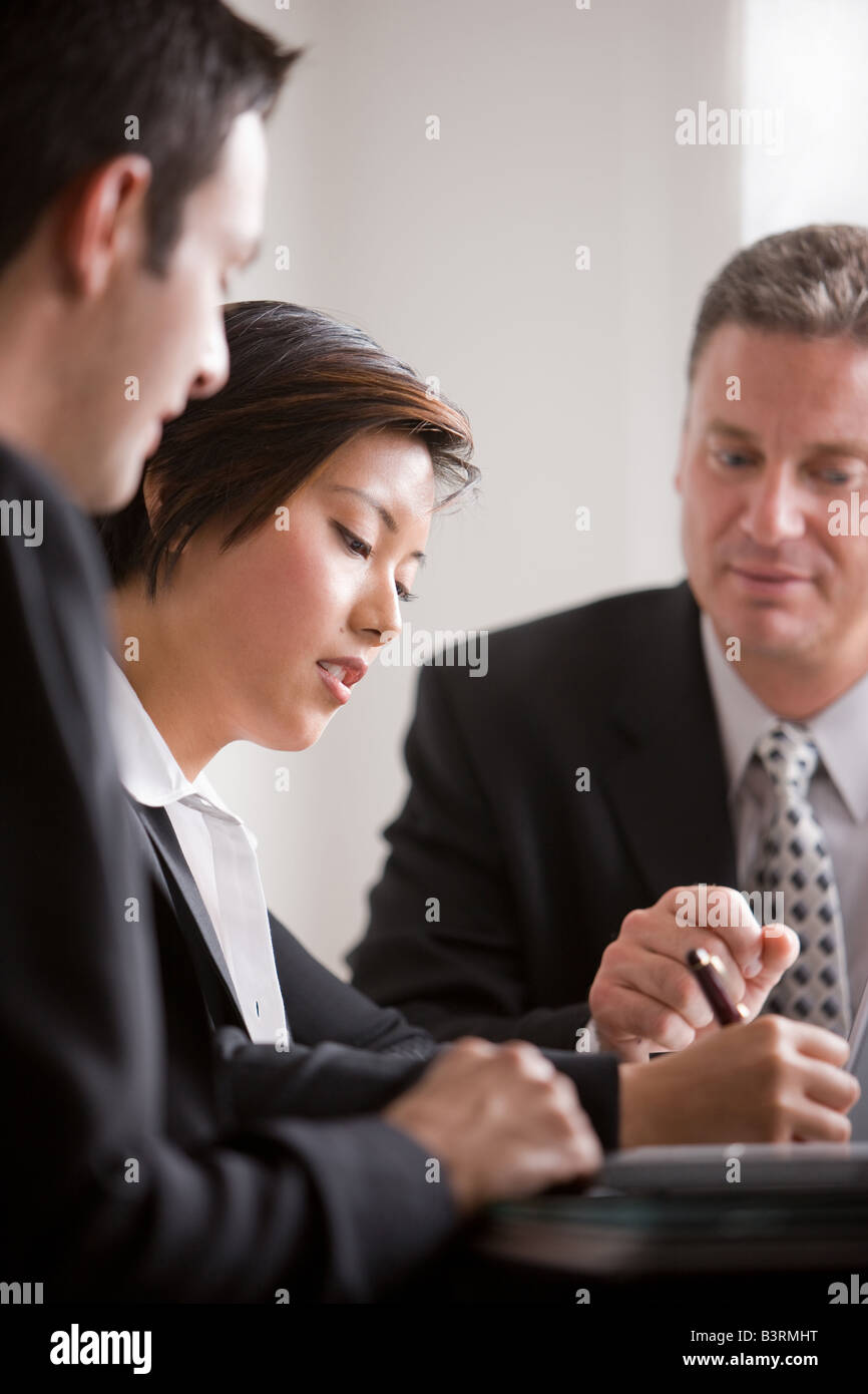 Three people meeting in a conference room Stock Photo - Alamy