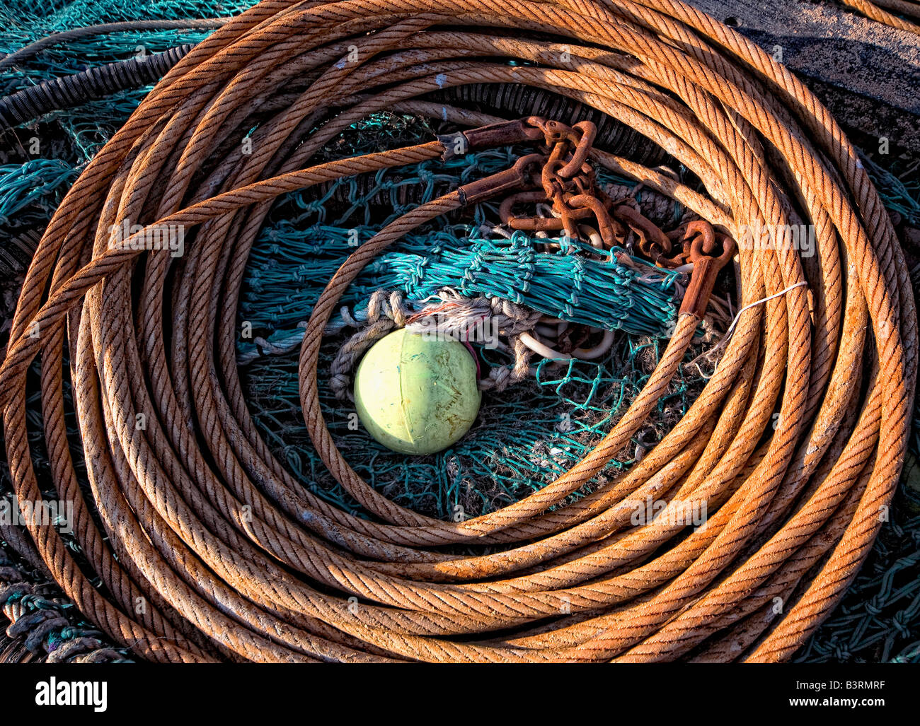 Coil of rope and fishing nets Stock Photo - Alamy