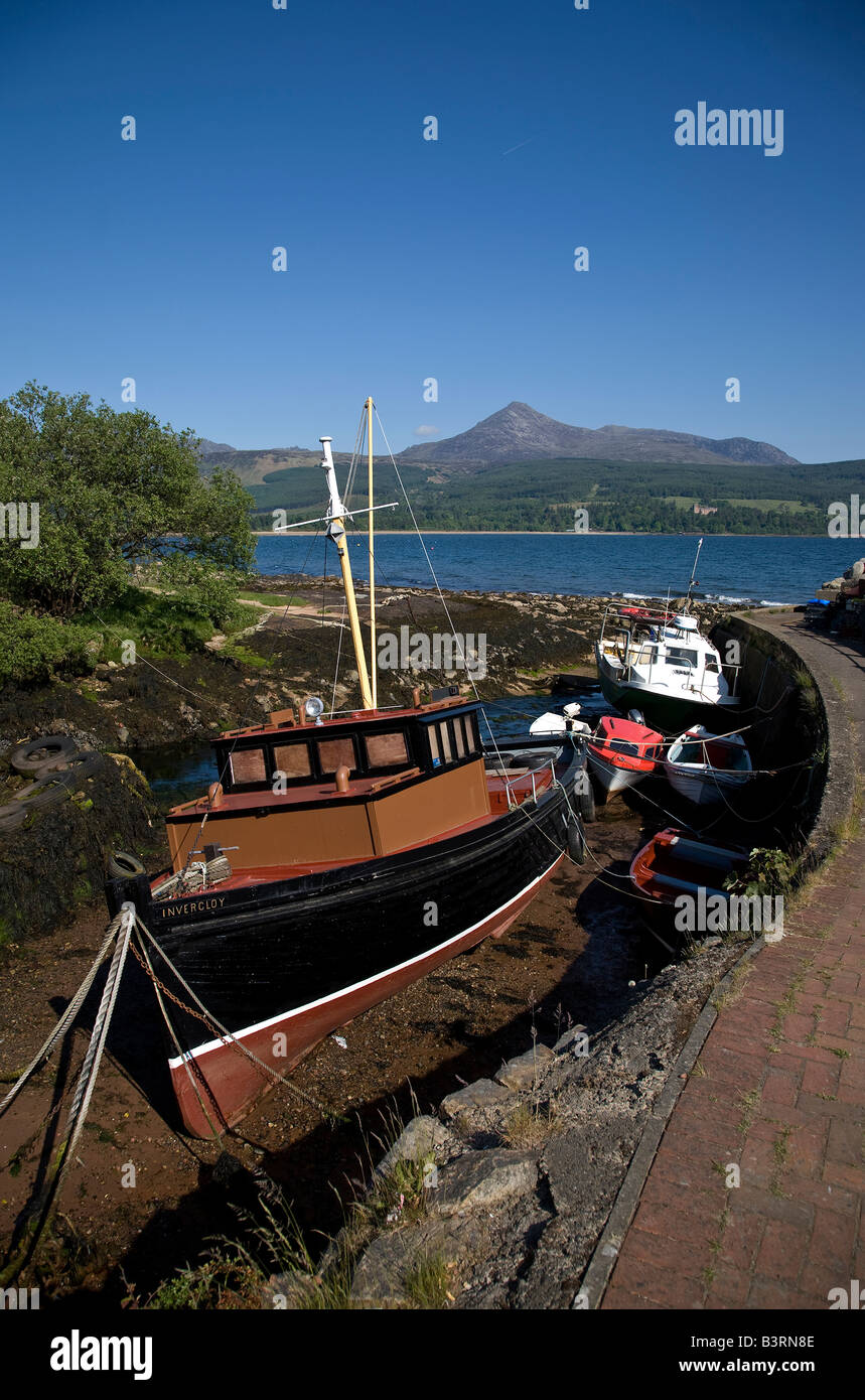 Boats lie in an inlet on Brodick beach on the Isle of Arran in south ...