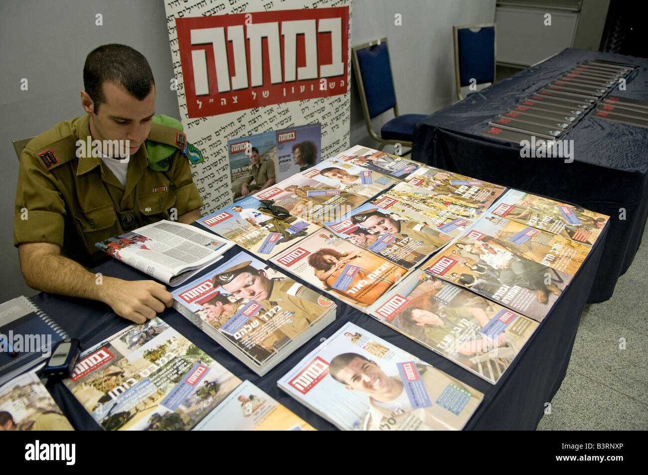 IDF soldier with collection of 'Bamahane' weekly magazines published by ...