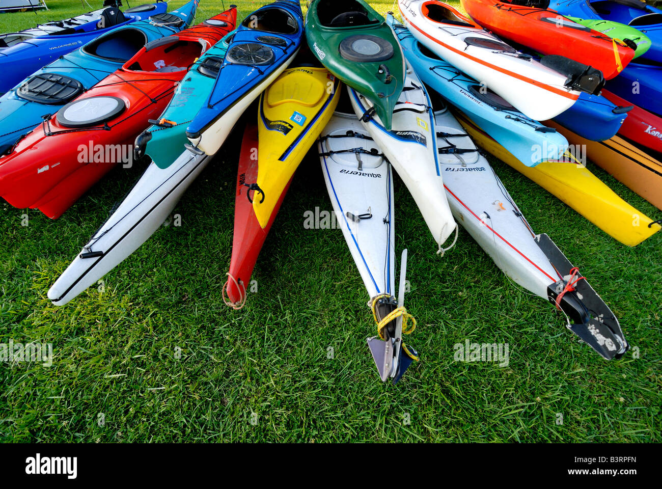 A large stack of kayaks in many bright colors Stock Photo - Alamy