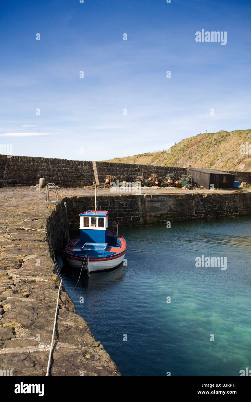 Tugboat moored to stone dock, Scotland Stock Photo - Alamy