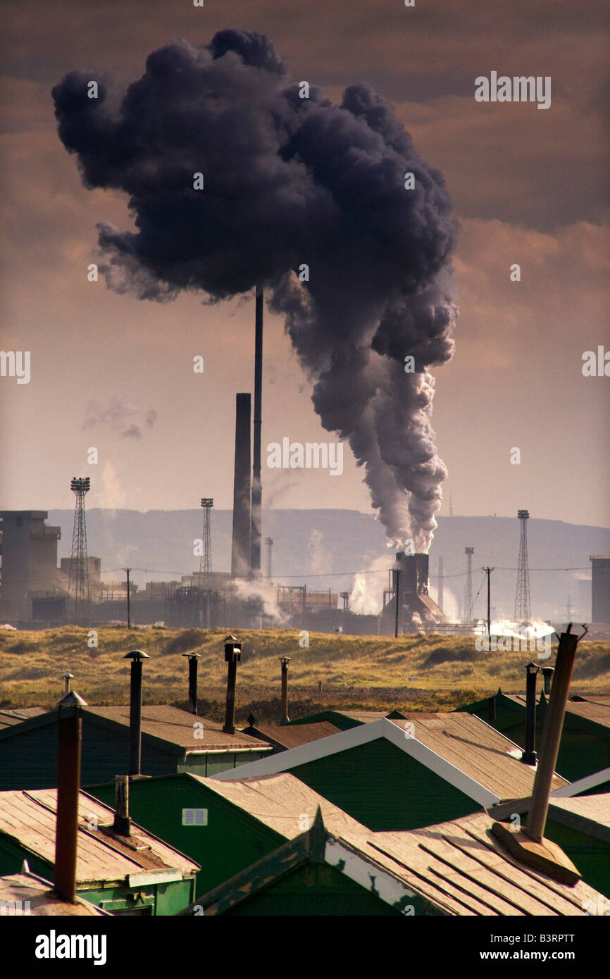 Smoke stacks behind dumpsters, Teesside, England Stock Photo - Alamy