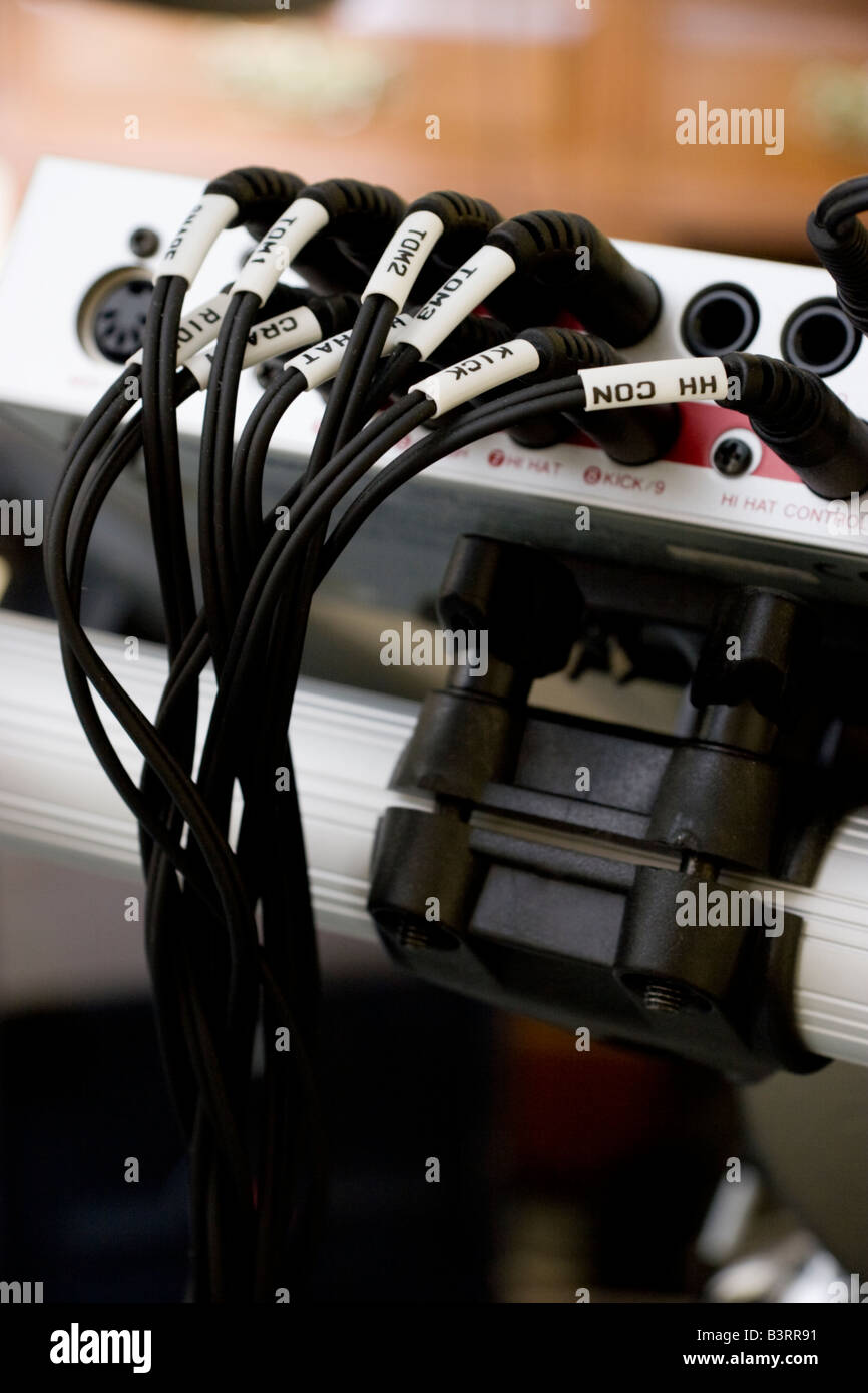 Audio jacks plugged in to the control box of an electronic drum kit ...