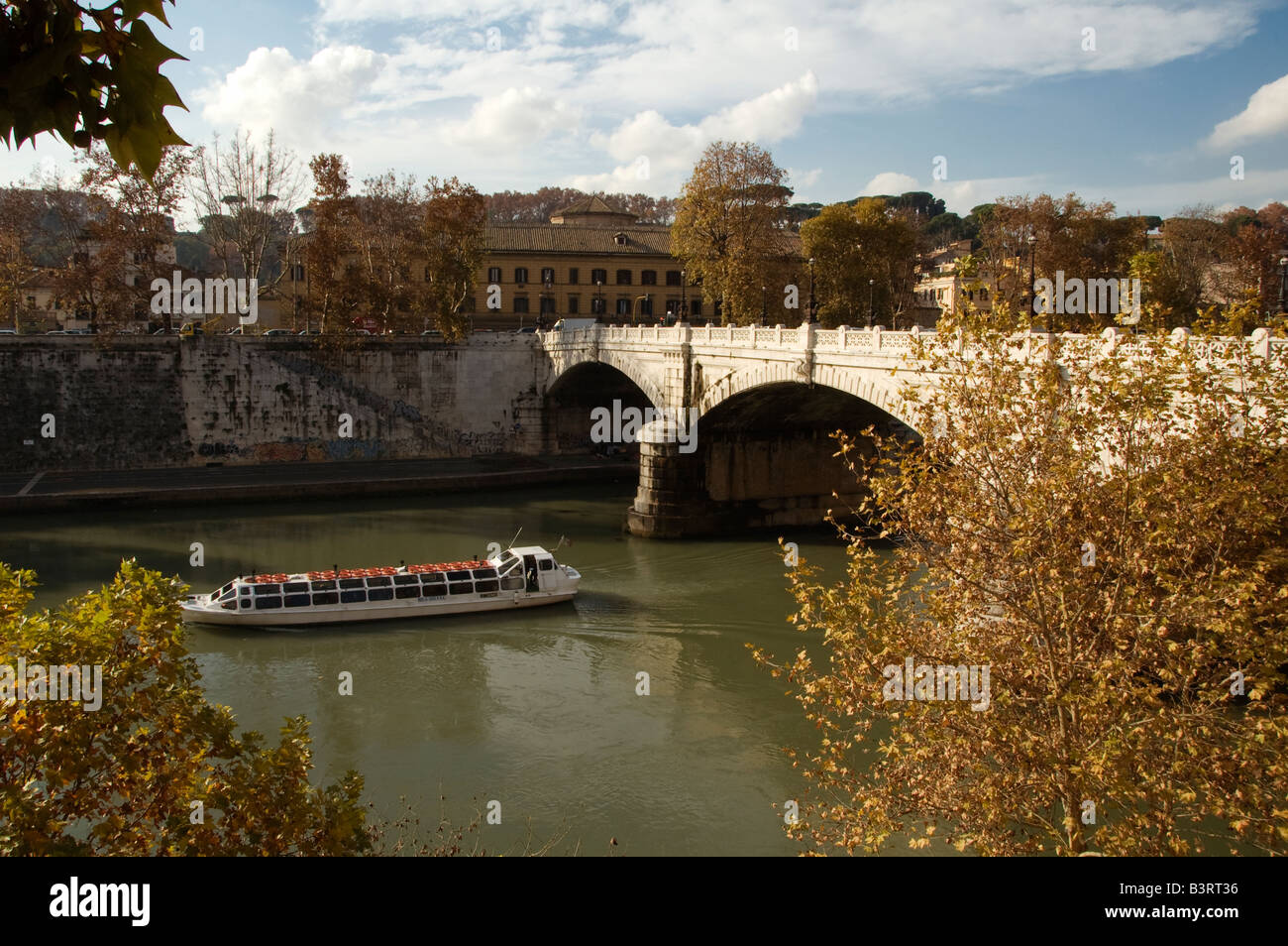 Tour boat passing Tiber river with Vatican city in background, Rome ...