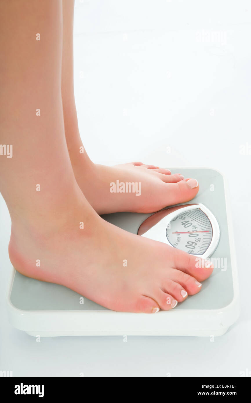 beautiful woman legs with scales on white Stock Photo - Alamy