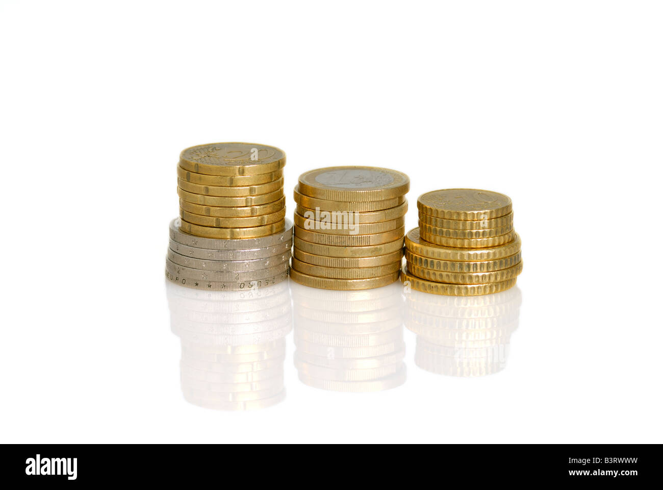 Stack of euro coins of different height with reflection on the table ...