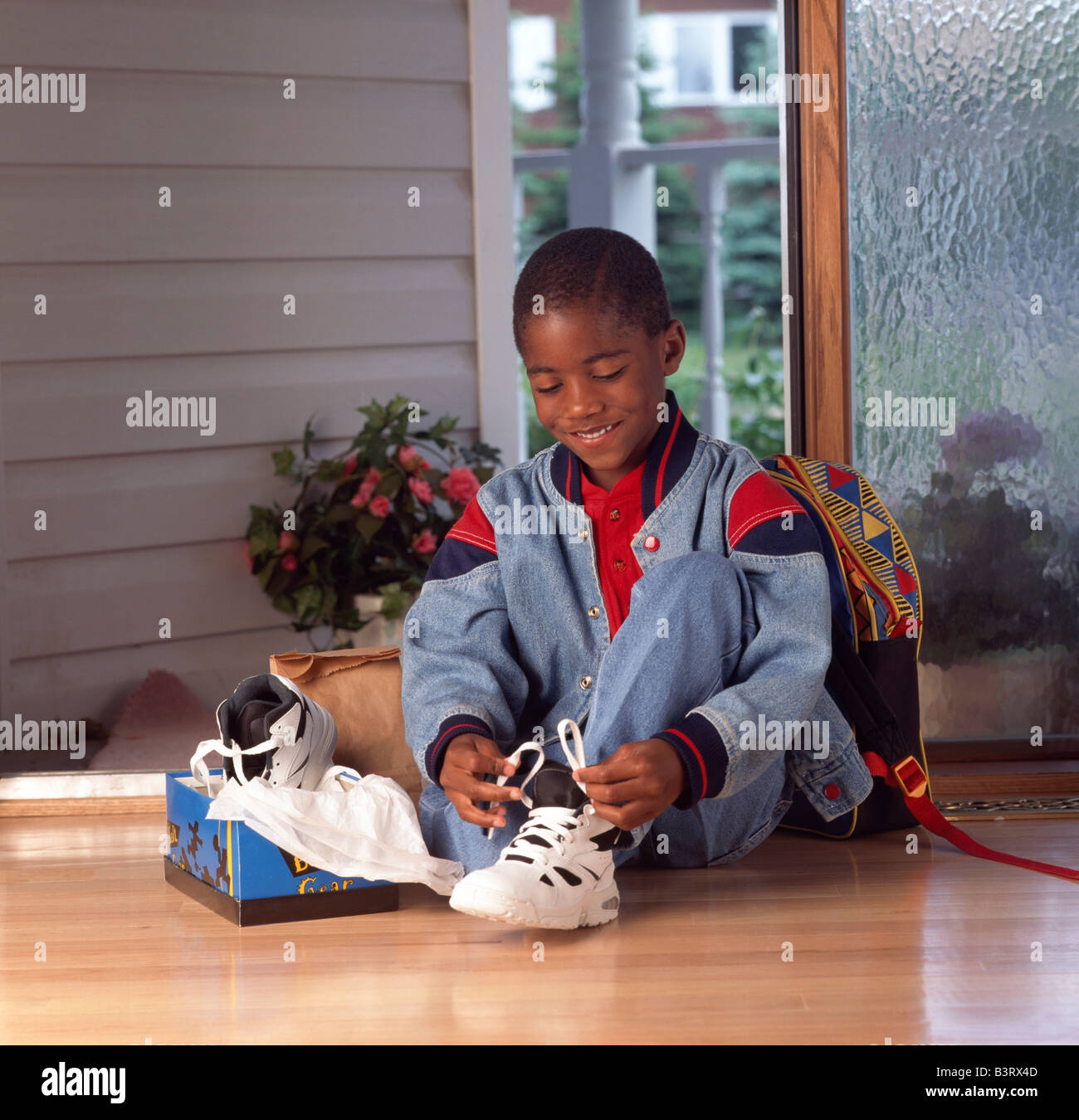 Boy tying his new shoe Stock Photo - Alamy