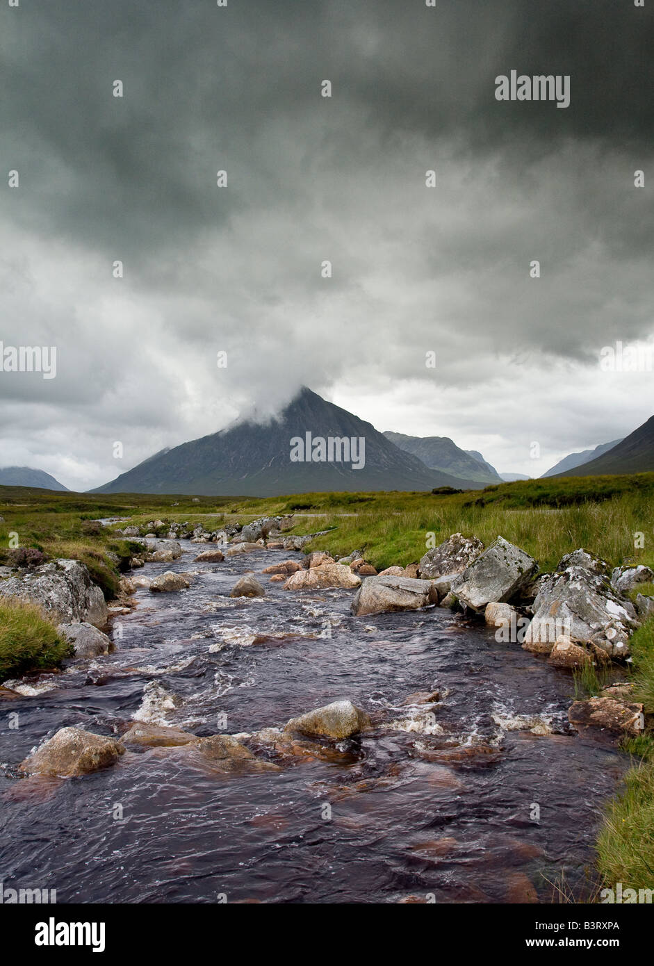 A stream running over Rannoch Moor in the highlands of Scotland with ...
