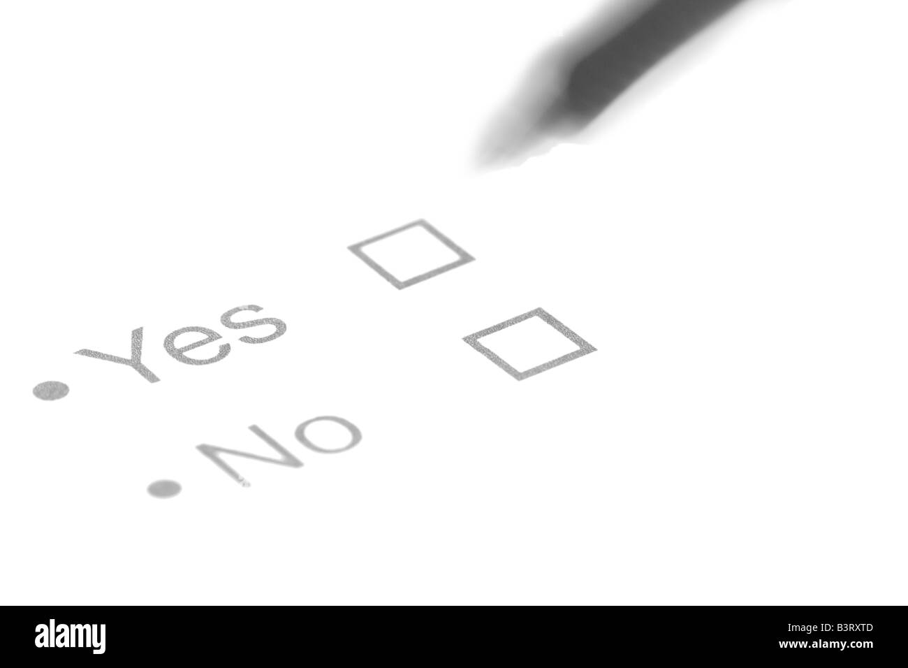 yes and no tickboxes with blurred pen Stock Photo - Alamy